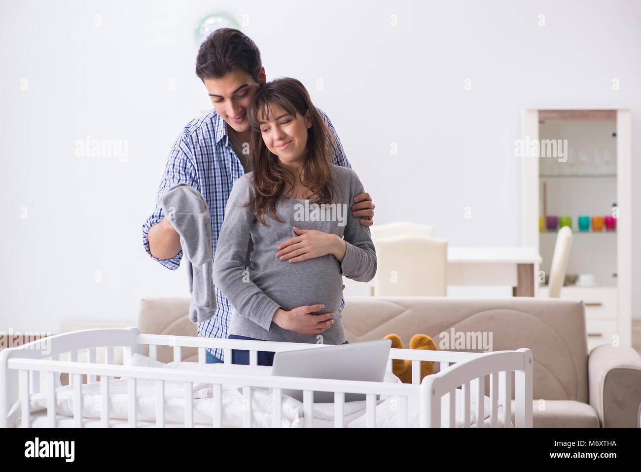 Young parents expecting their first baby Stock Photo - Alamy