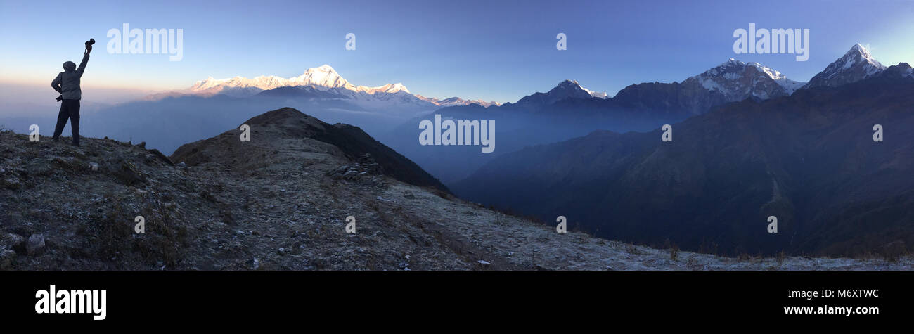 A man standing on Himalaya Mountains at sunrise, view from Khopra ...