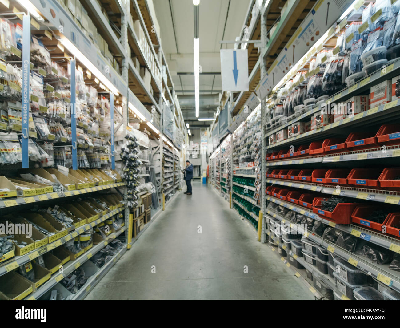 warehouse aisle of building materials in industiral DIY store. Shallow ...