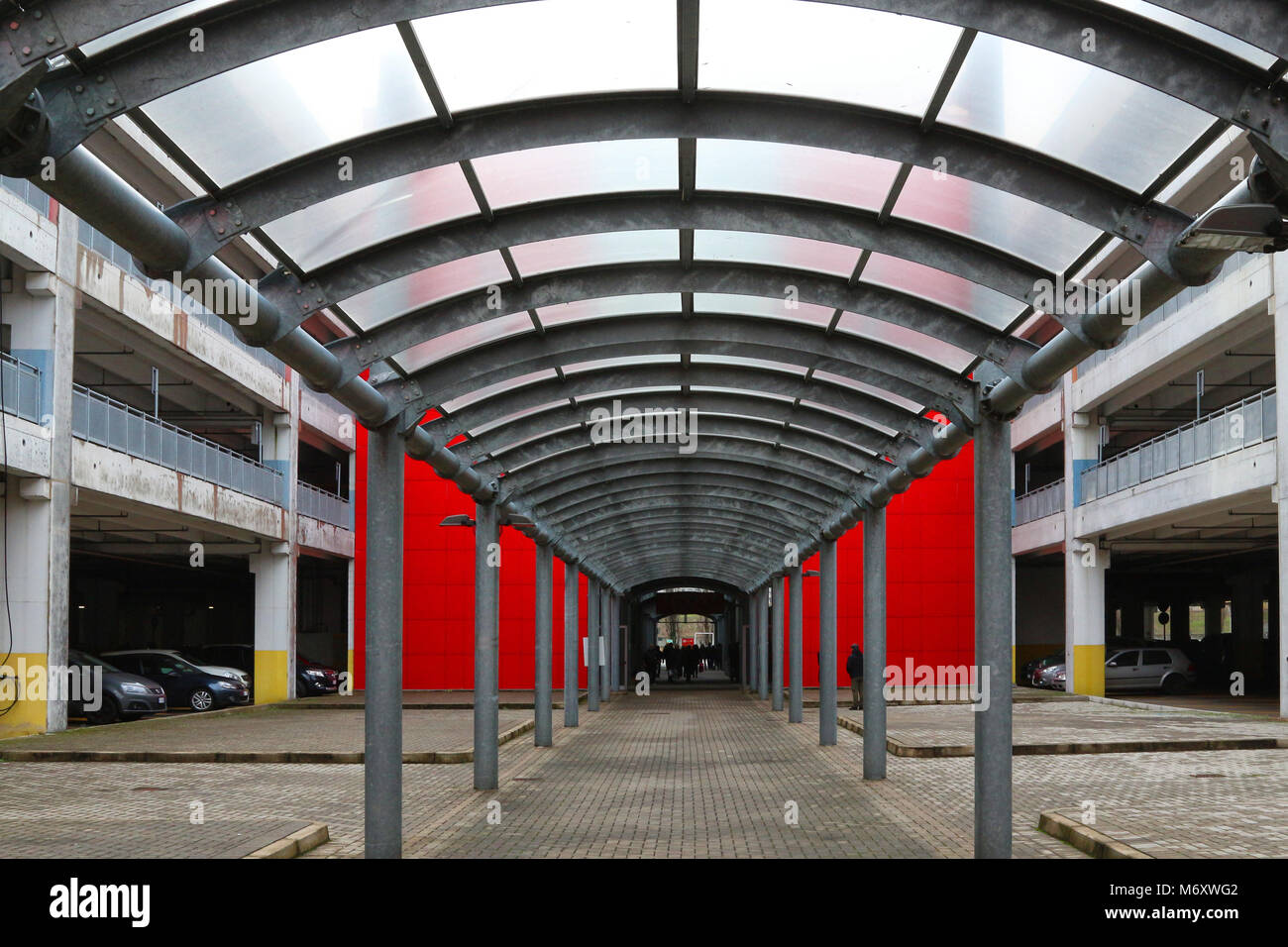 Covered walkway in the modern parking structure Stock Photo - Alamy