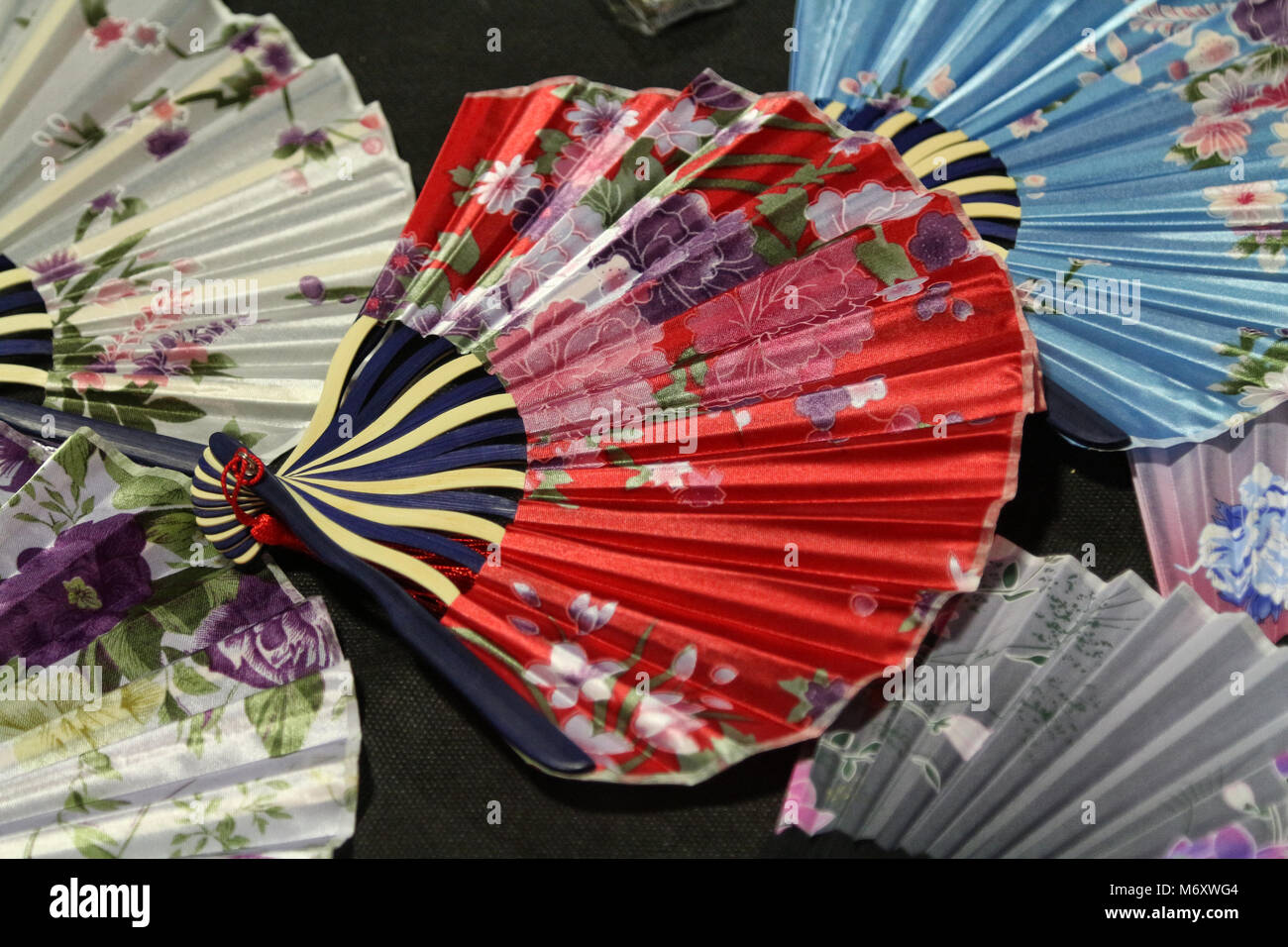 Chinese coloured and decorated fan Stock Photo - Alamy