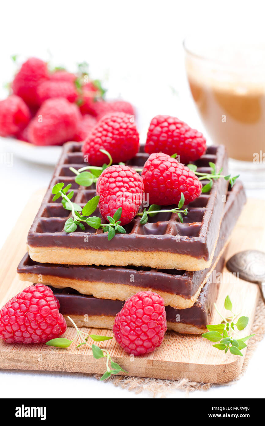 Stack of chocolate waffles with fresh raspberry and cup of coffee Stock ...