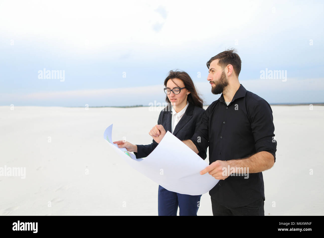CEO male and CFO female discussing project of wind power pla Stock ...