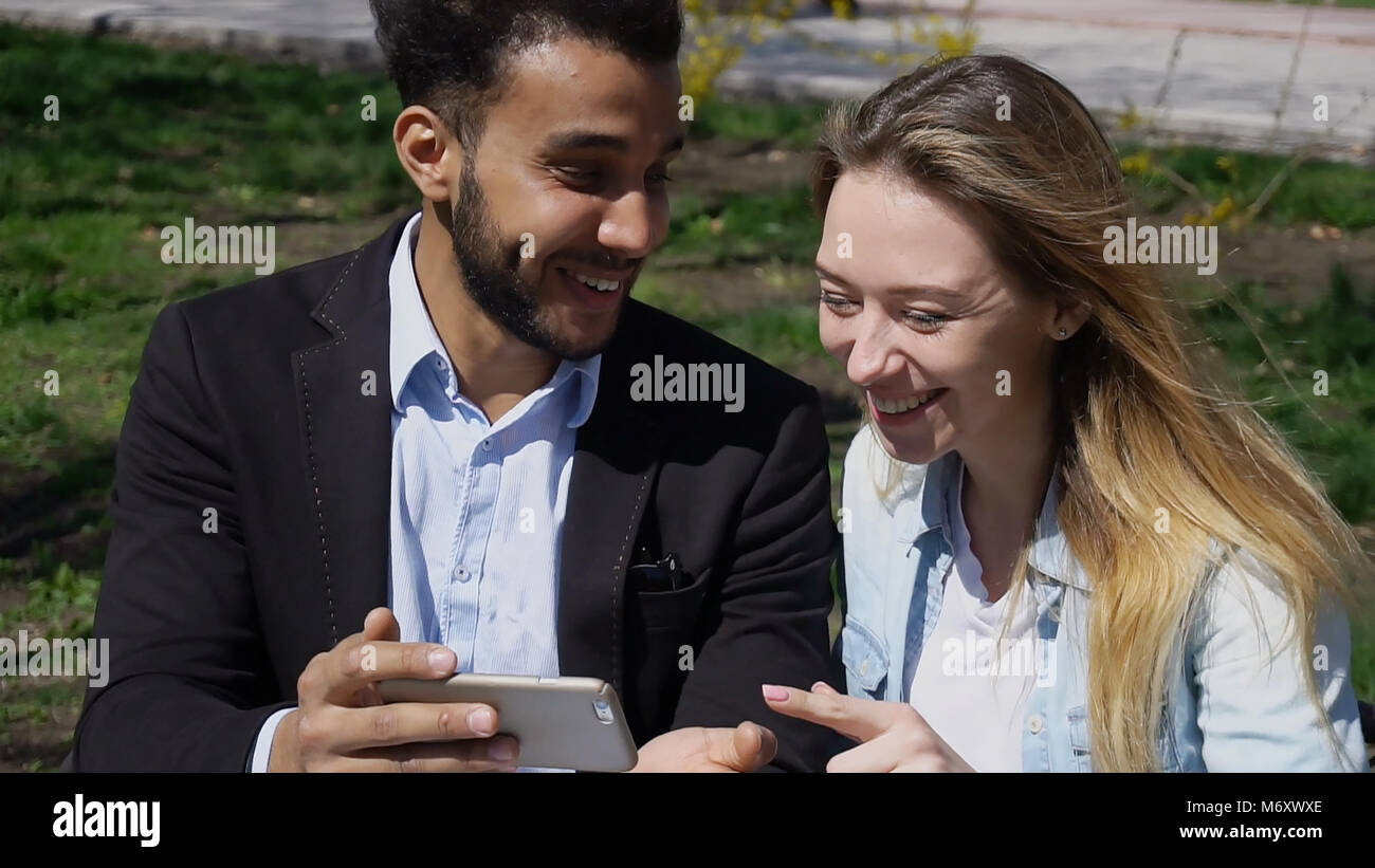 Wife give phone husband as birthday present Stock Photo - Alamy
