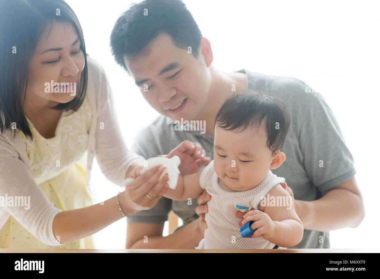 Asian mom cleaning her son hi-res stock photography and images - Alamy
