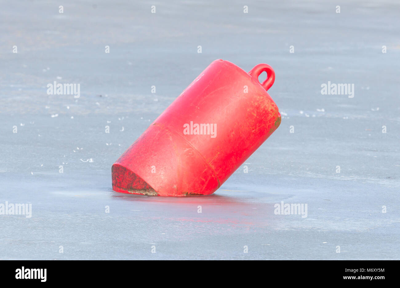 Red buoy in a large pond - Selective focus Stock Photo - Alamy