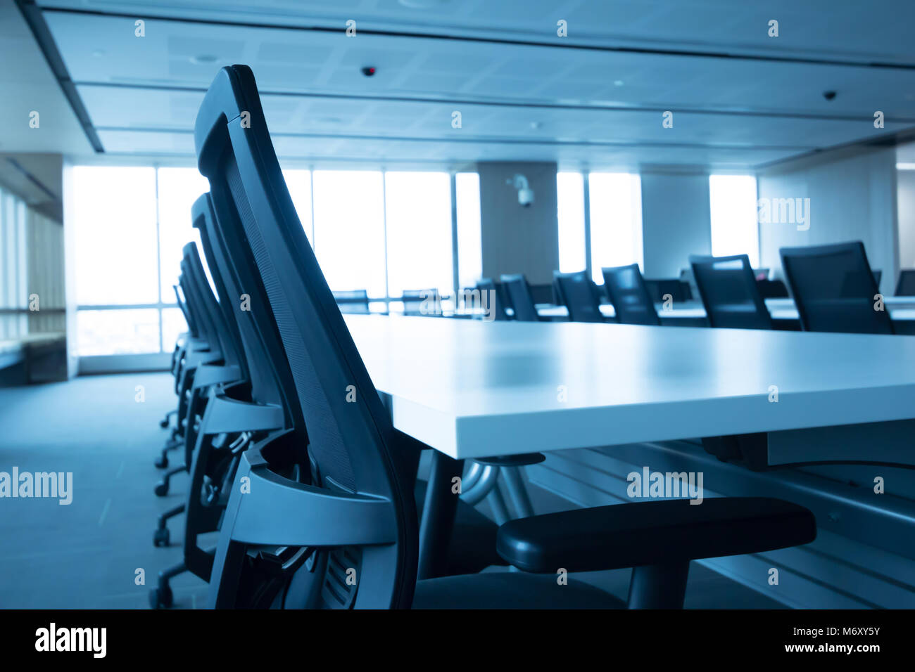 Table and chairs in meeting room Stock Photo - Alamy