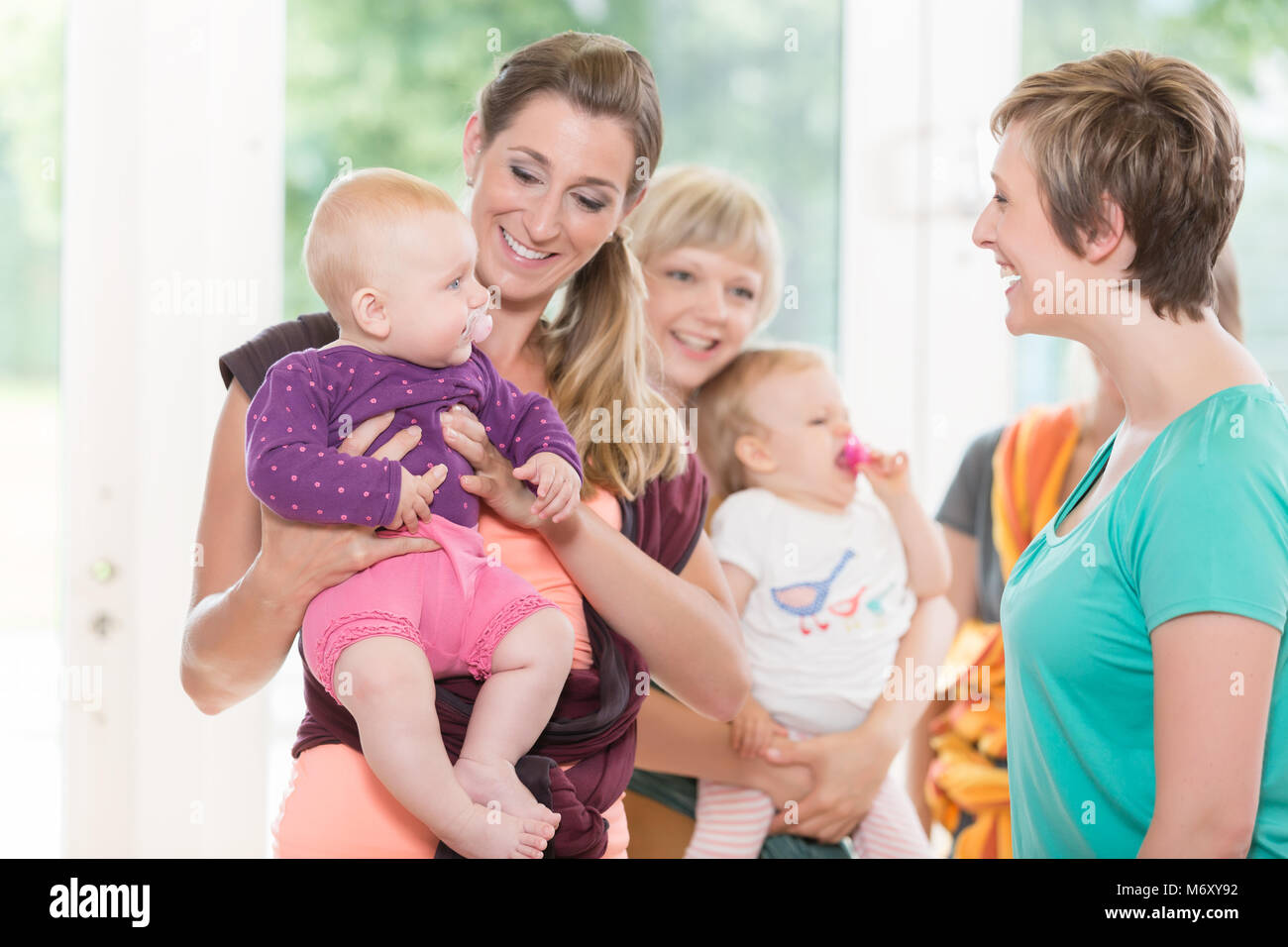 Group of women learning how to use baby slings for mother-child Stock ...