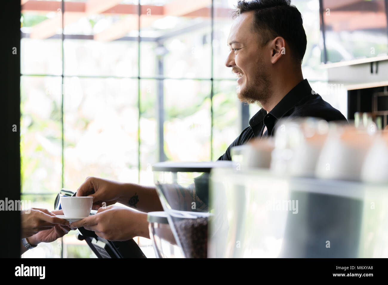 Bartender serving two hi-res stock photography and images - Alamy