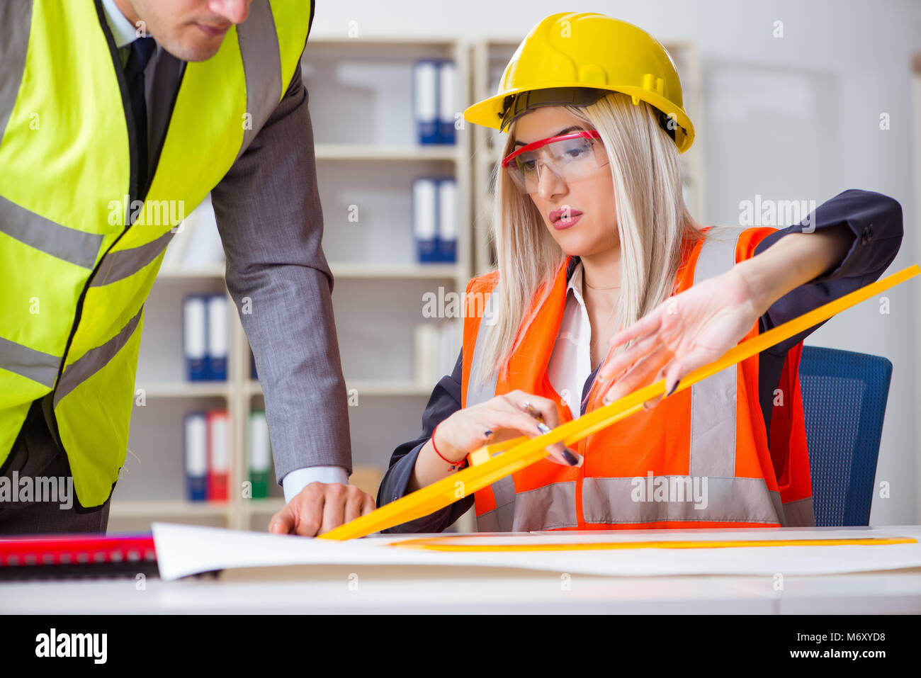 Construction workers having discussion in office before starting ...