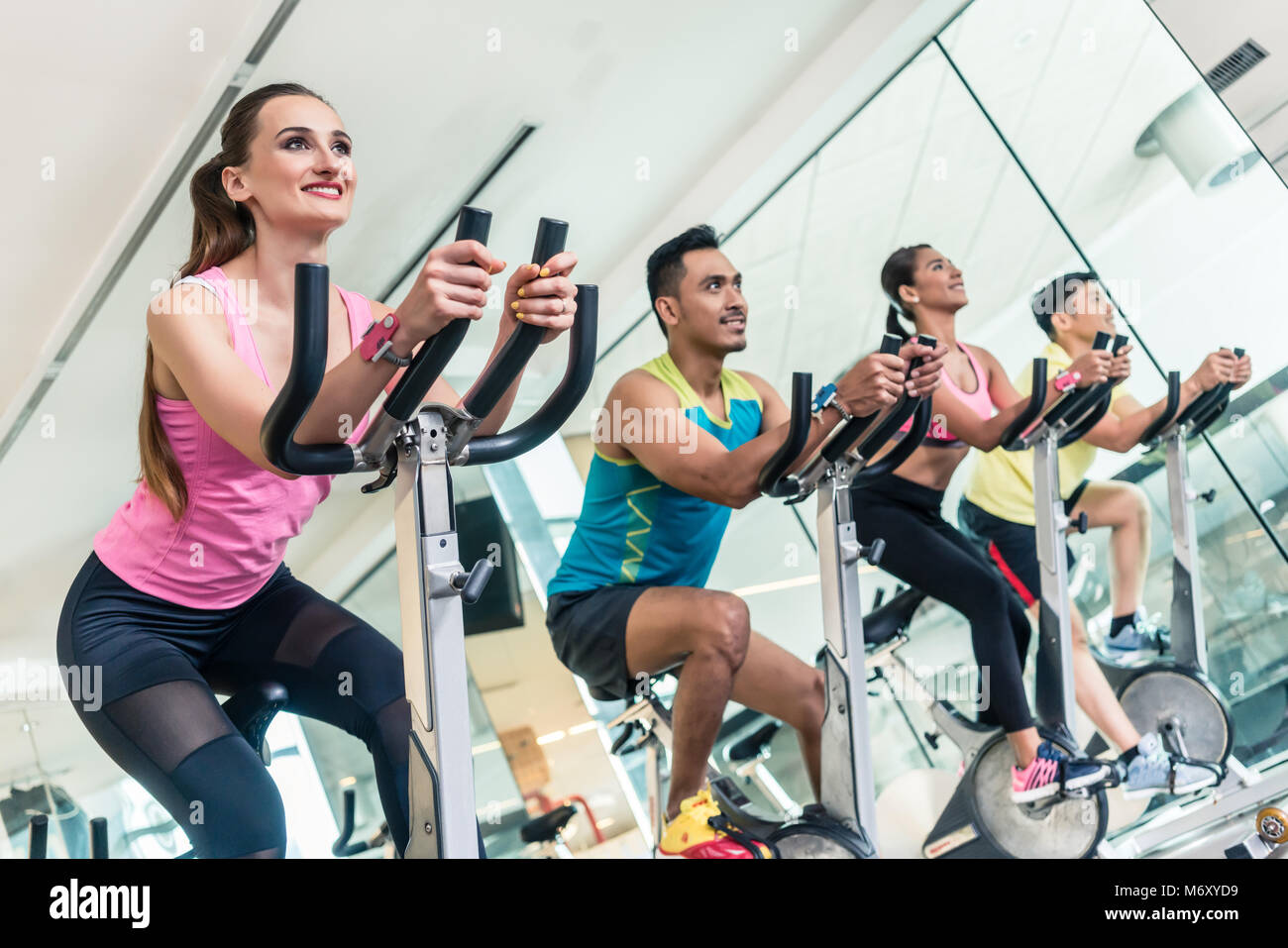 Beautiful fit woman smiling during cardio workout Stock Photo - Alamy