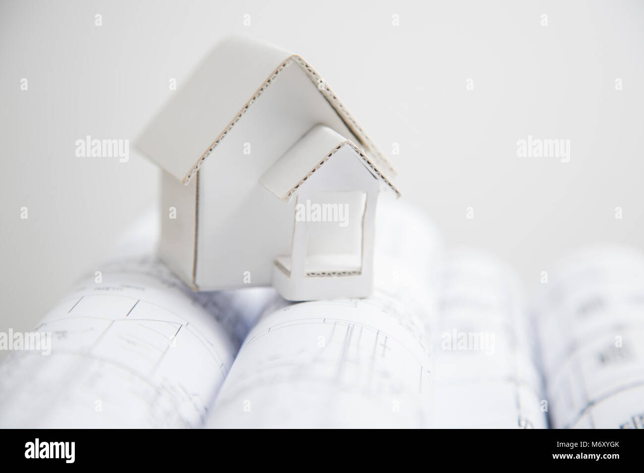Paper model house on a blueprint Stock Photo - Alamy