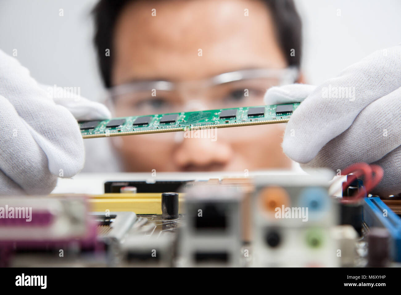 Expert engineers examining computer equipment Stock Photo - Alamy