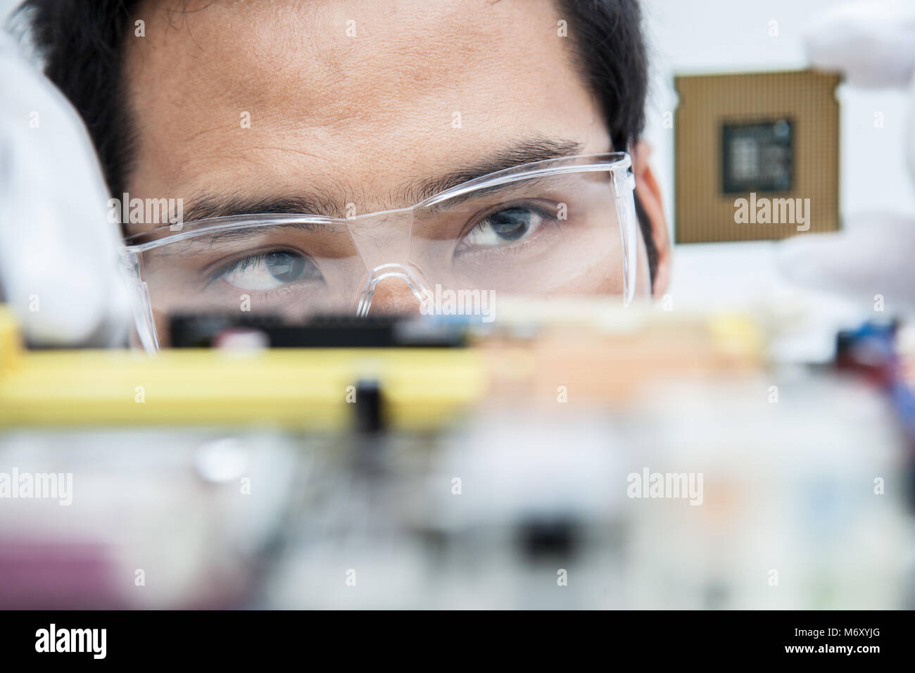 Expert engineers examining computer equipment Stock Photo - Alamy