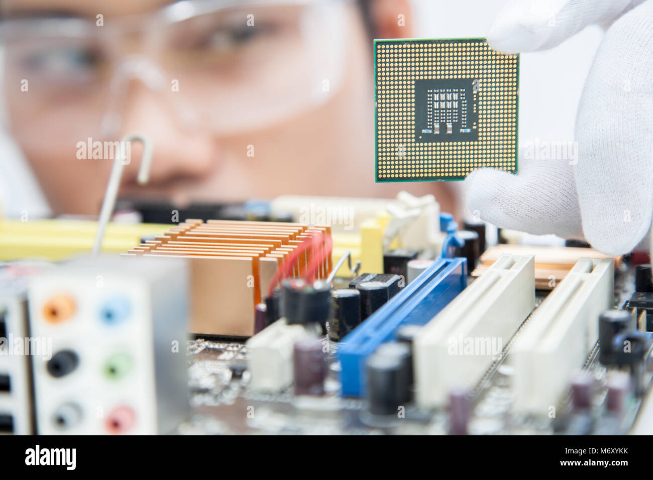 Expert engineers examining computer equipment Stock Photo - Alamy