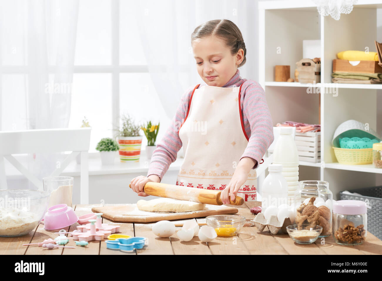 Girl cooking in home kitchen, making dough, healthy food concept Stock ...