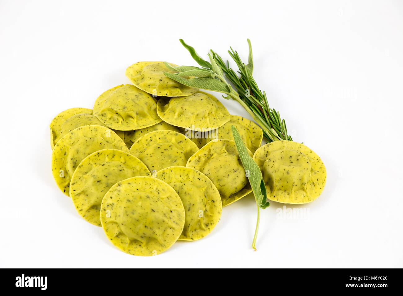 Green ravioli with sage and rosemary Stock Photo - Alamy