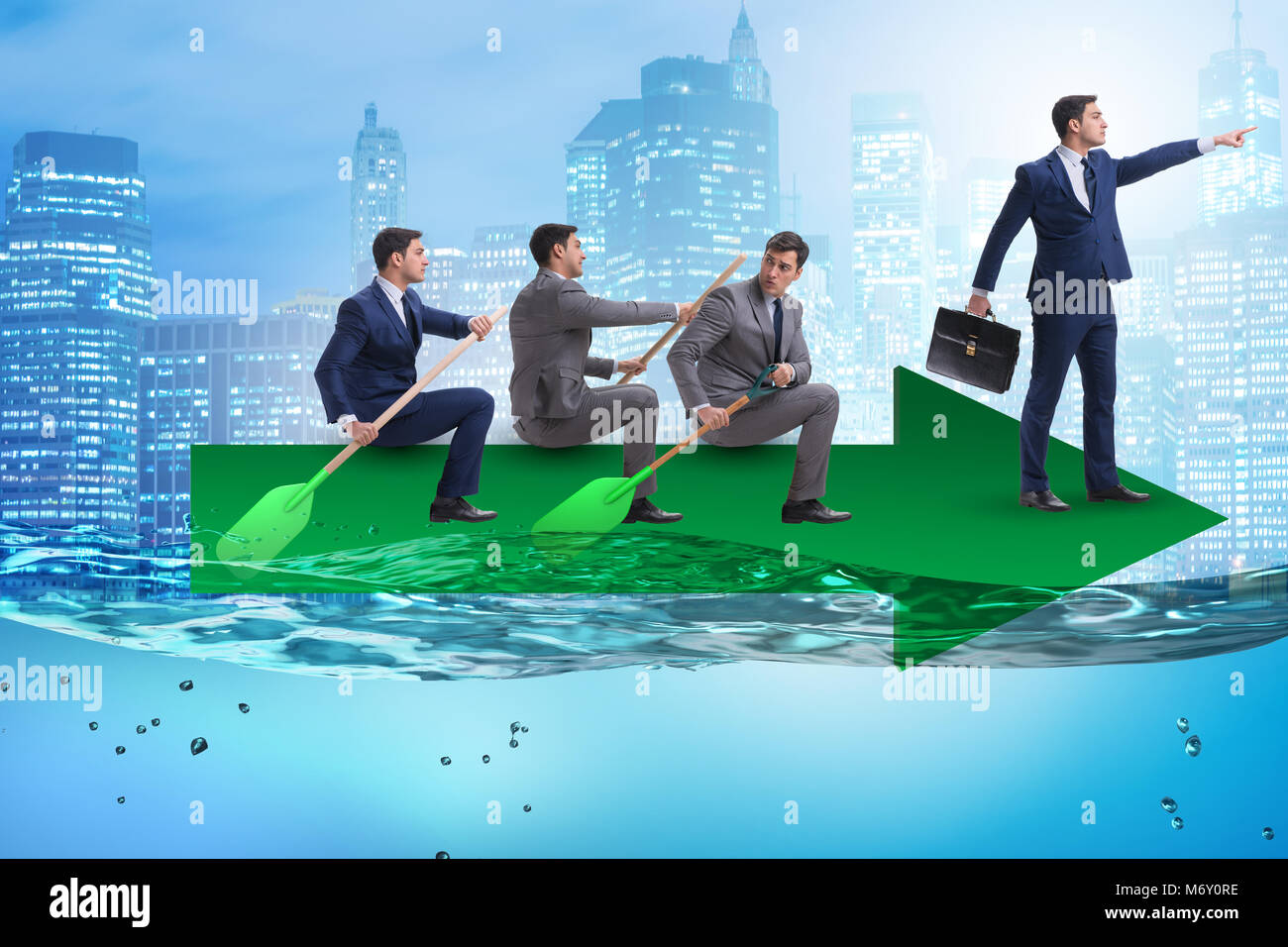 Teamwork concept with businessmen on boat Stock Photo - Alamy