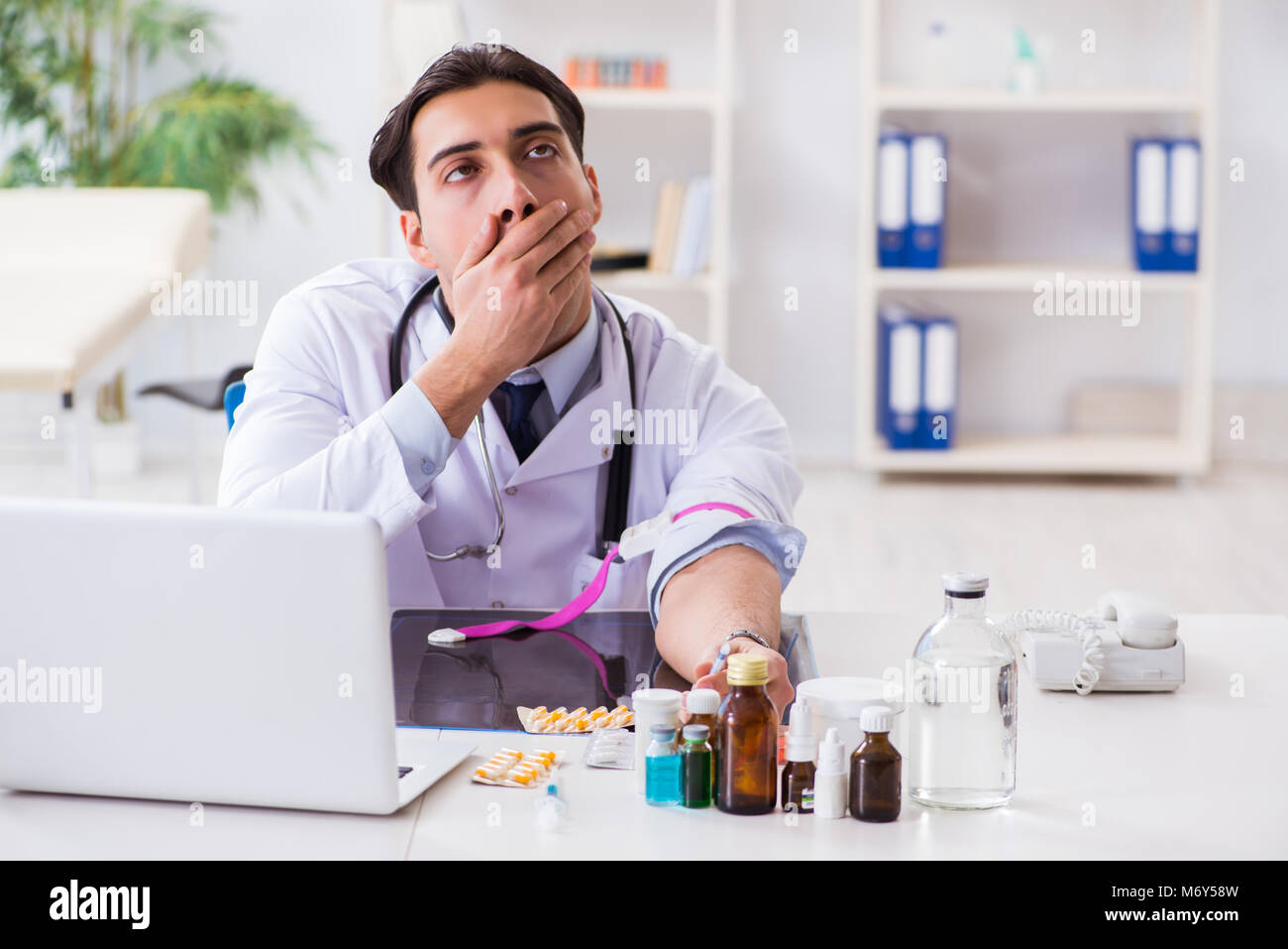 Doctor drug addict in the hospital Stock Photo - Alamy