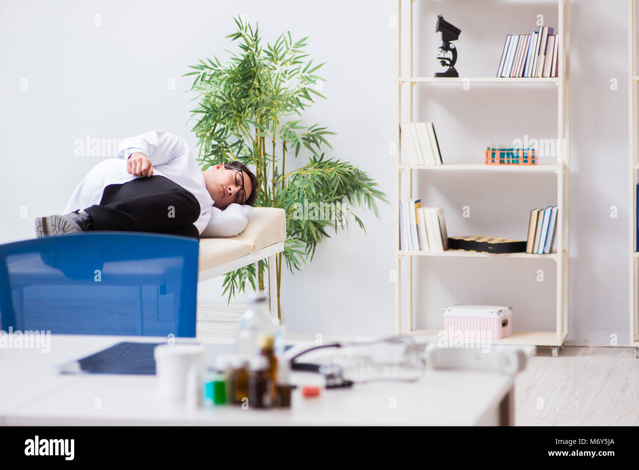 Doctor relaxing after complex surgery in hospital Stock Photo - Alamy