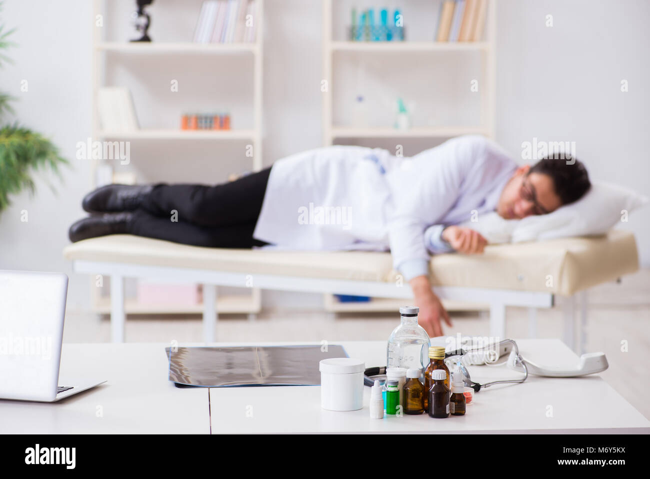Doctor relaxing after complex surgery in hospital Stock Photo - Alamy
