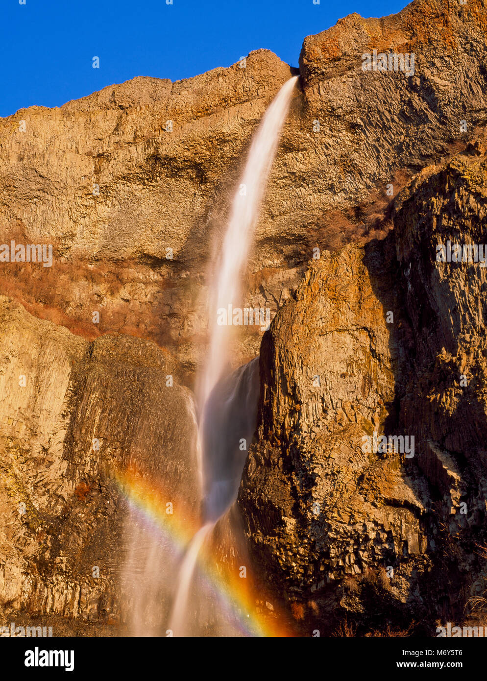 waterfall cascading over basalt cliffs in the columbia plateau near ...