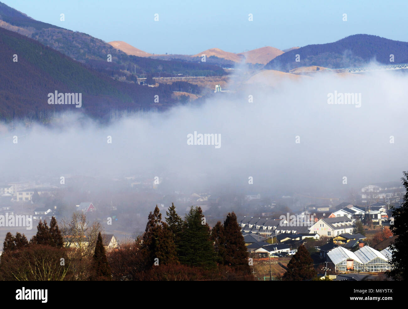 Morning fog over the town of Yufu, Japan Stock Photo - Alamy