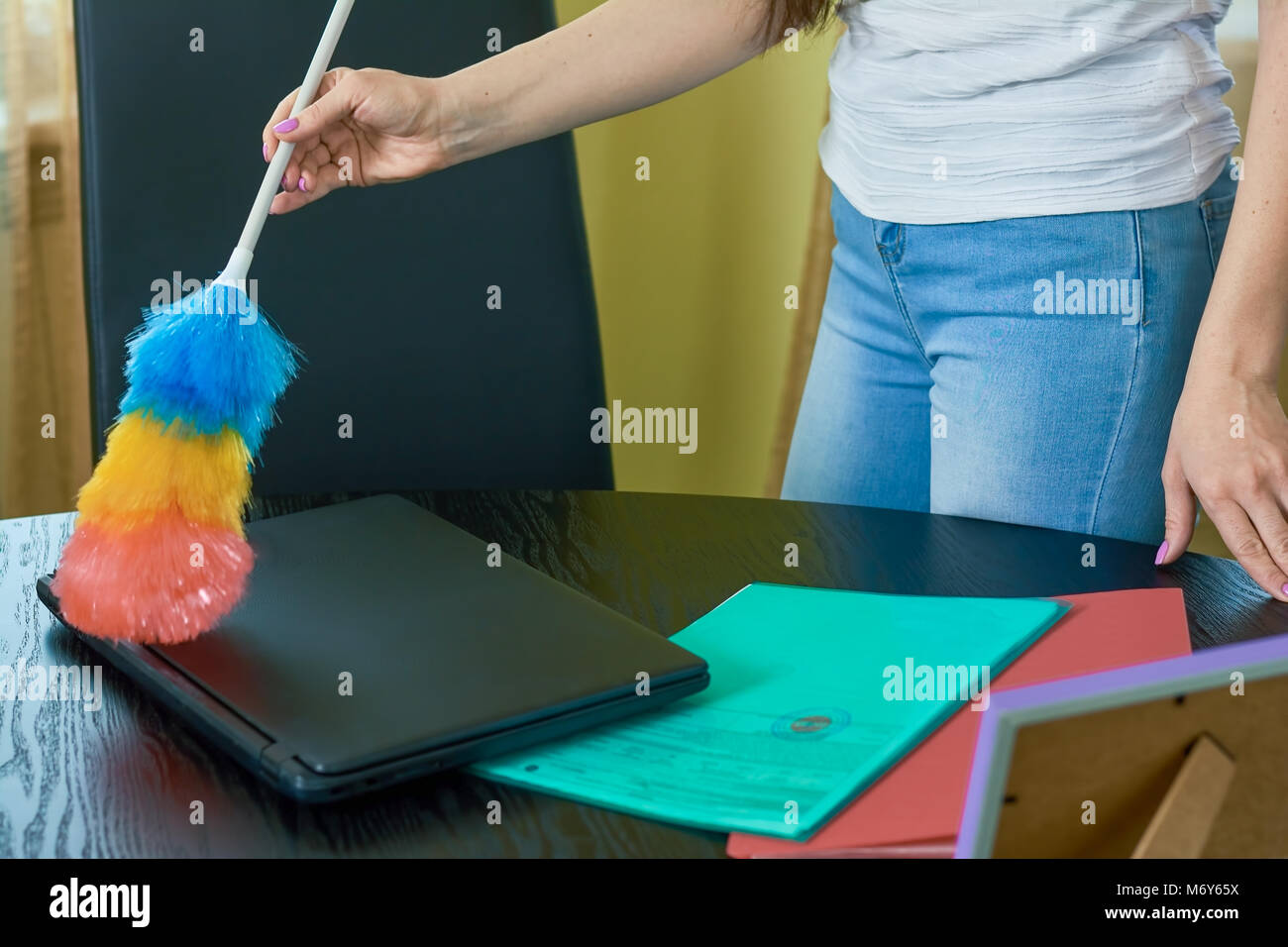 Female hand using duster Stock Photo - Alamy