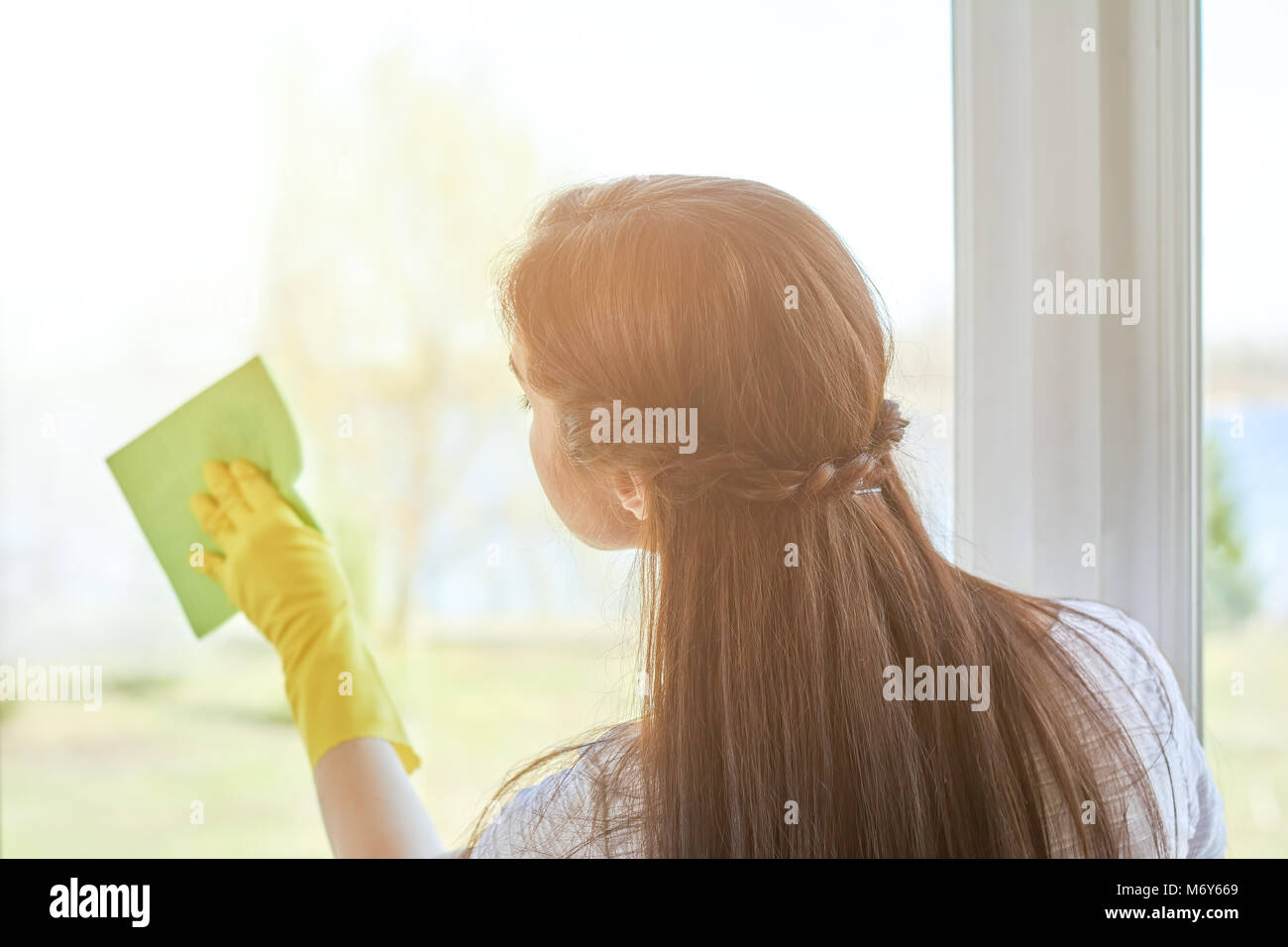 Woman cleaning a window Stock Photo - Alamy
