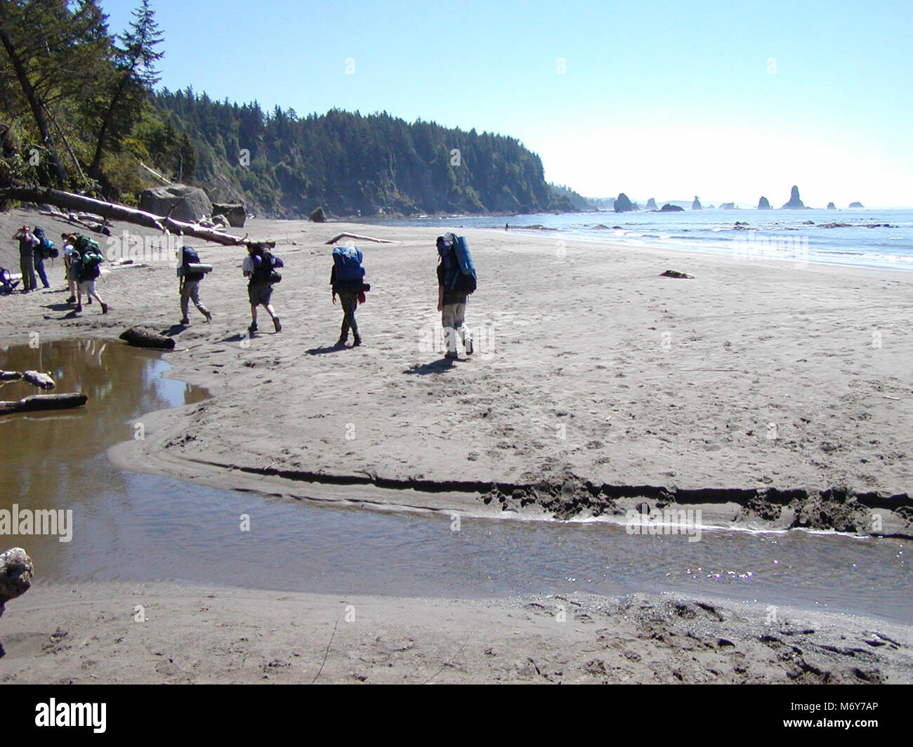 backpackers beach hike group Stock Photo - Alamy