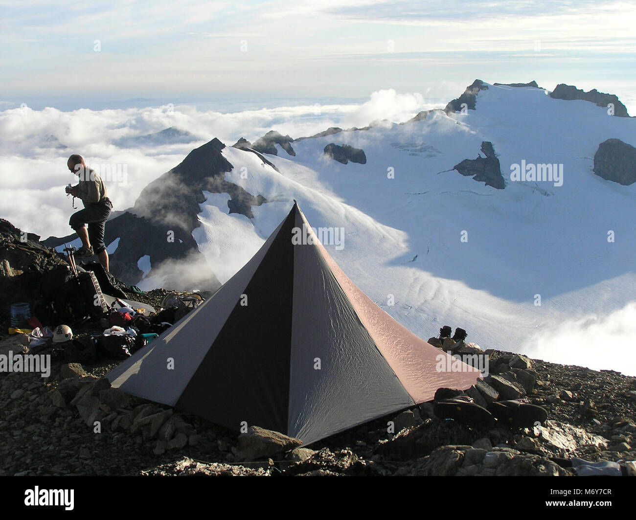 backpacking alpine mountains peaks tent camping visitor Stock Photo - Alamy