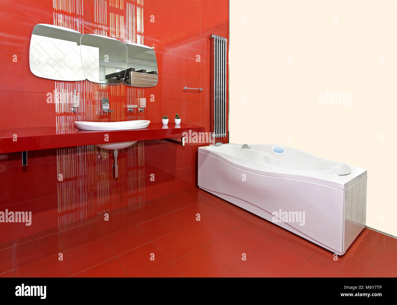 Modern bathroom with red ceramic walls and contemporary fixtures Stock ...