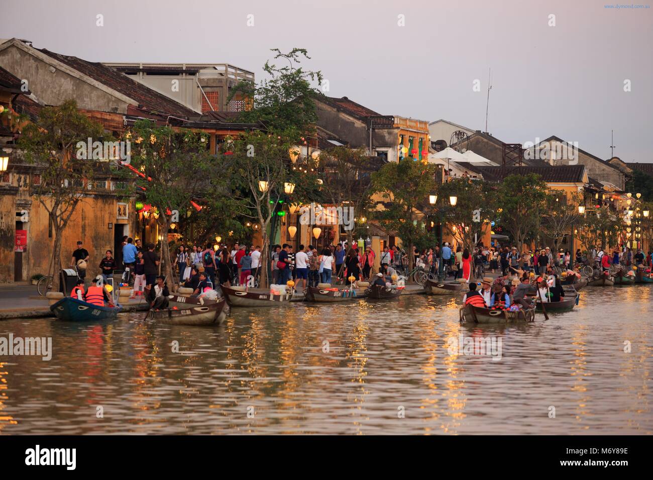 As twilight falls upon Bach Dang Street tourists take to boats on the ...