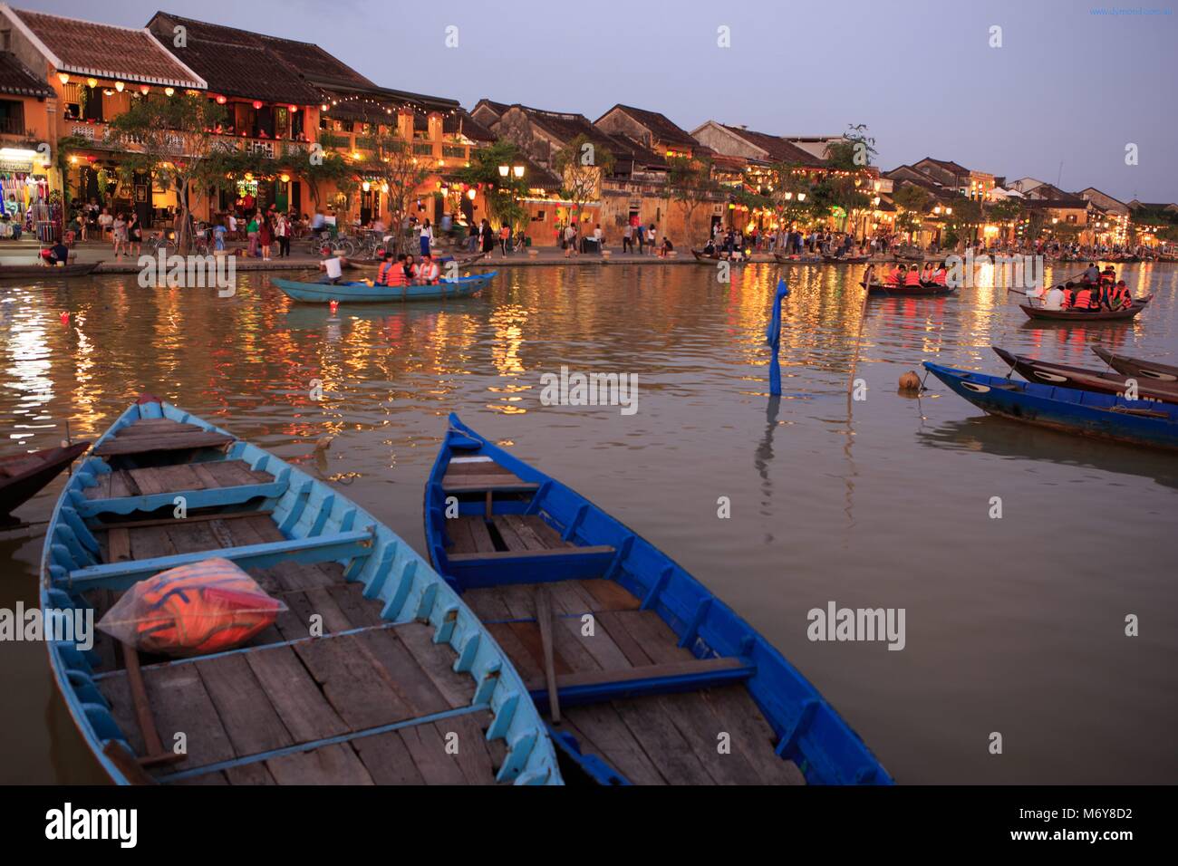 Wooden boats moored on the Thu Bon river opposite Bach Dang Street in ...