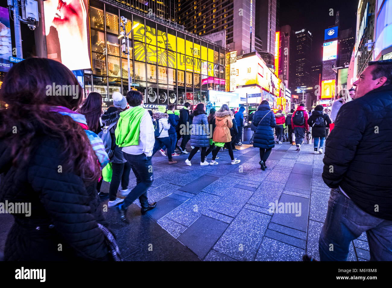 People walking in Times Square at night, midtown Manhattan, New York ...
