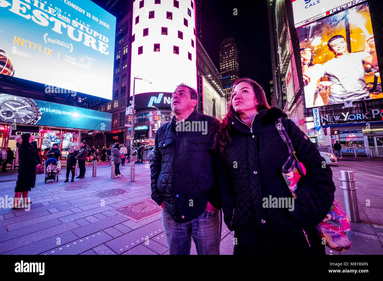 People walking in Times Square at night, midtown Manhattan, New York ...