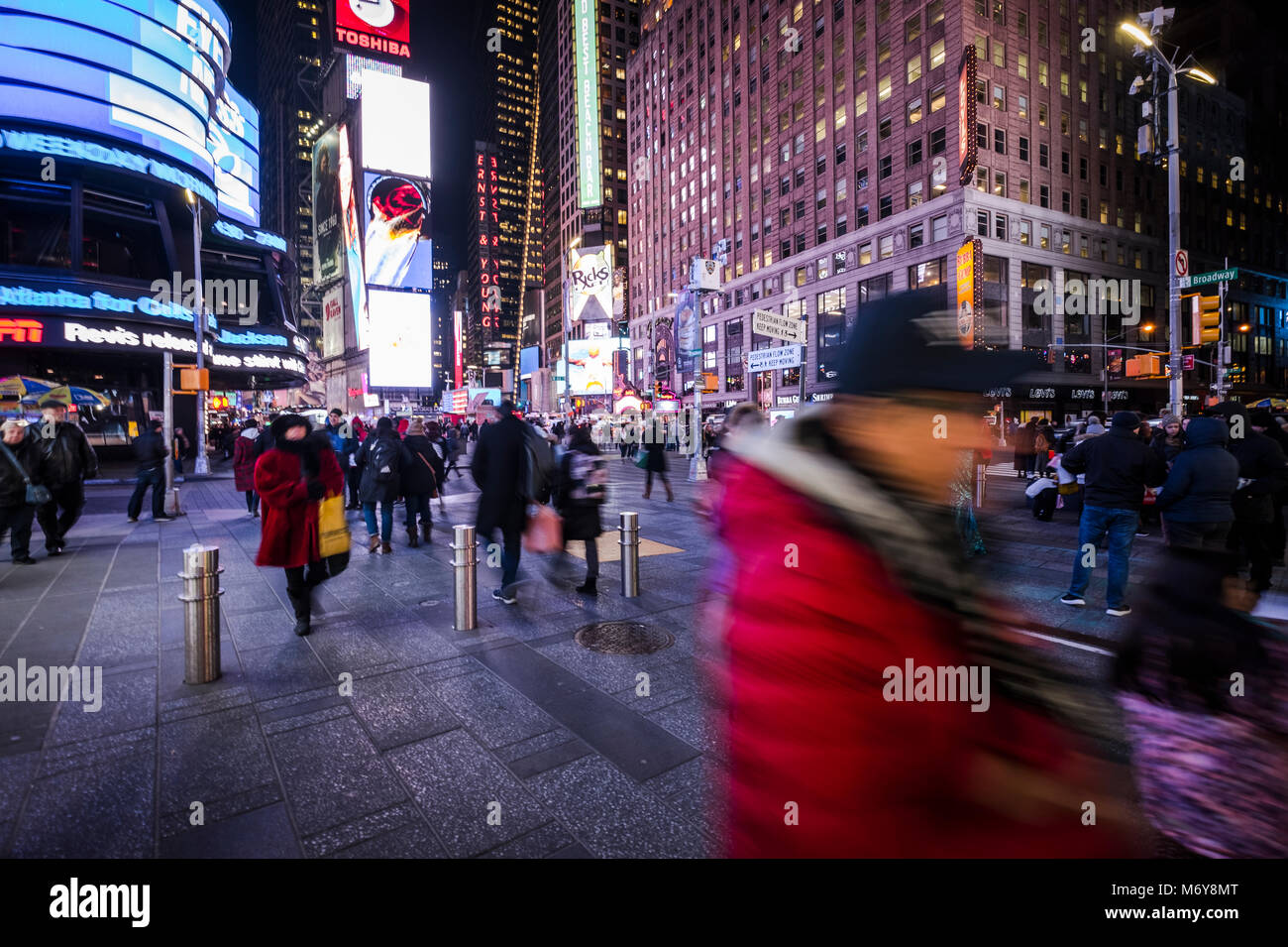 People walking in Times Square at night, midtown Manhattan, New York ...