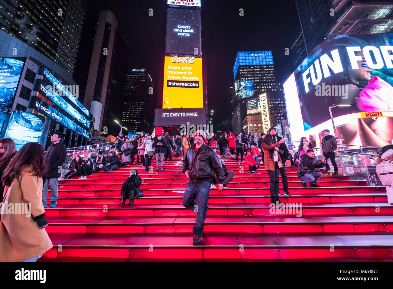People walking in Times Square at night, midtown Manhattan, New York ...