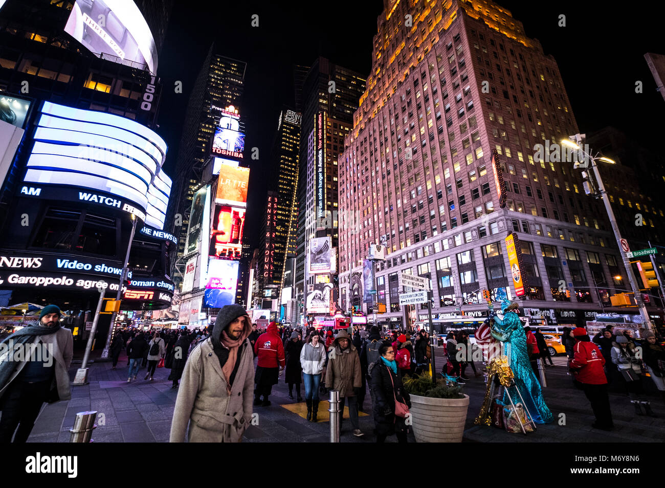 People walking in Times Square at night, midtown Manhattan, New York ...