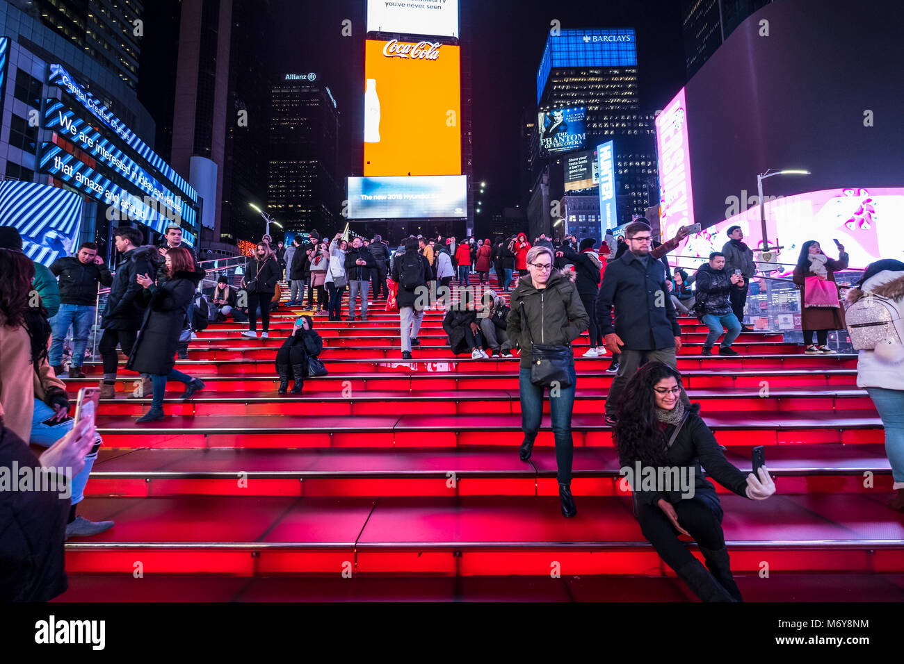 People walking in Times Square at night, midtown Manhattan, New York ...
