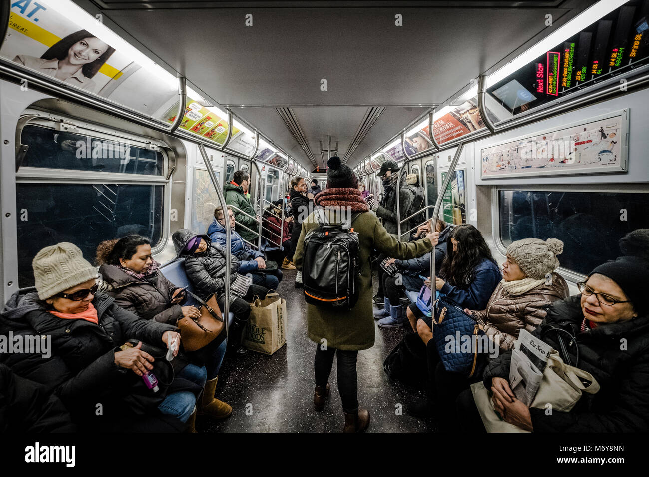 Commuters in subway wagon at New York subway system Stock Photo - Alamy