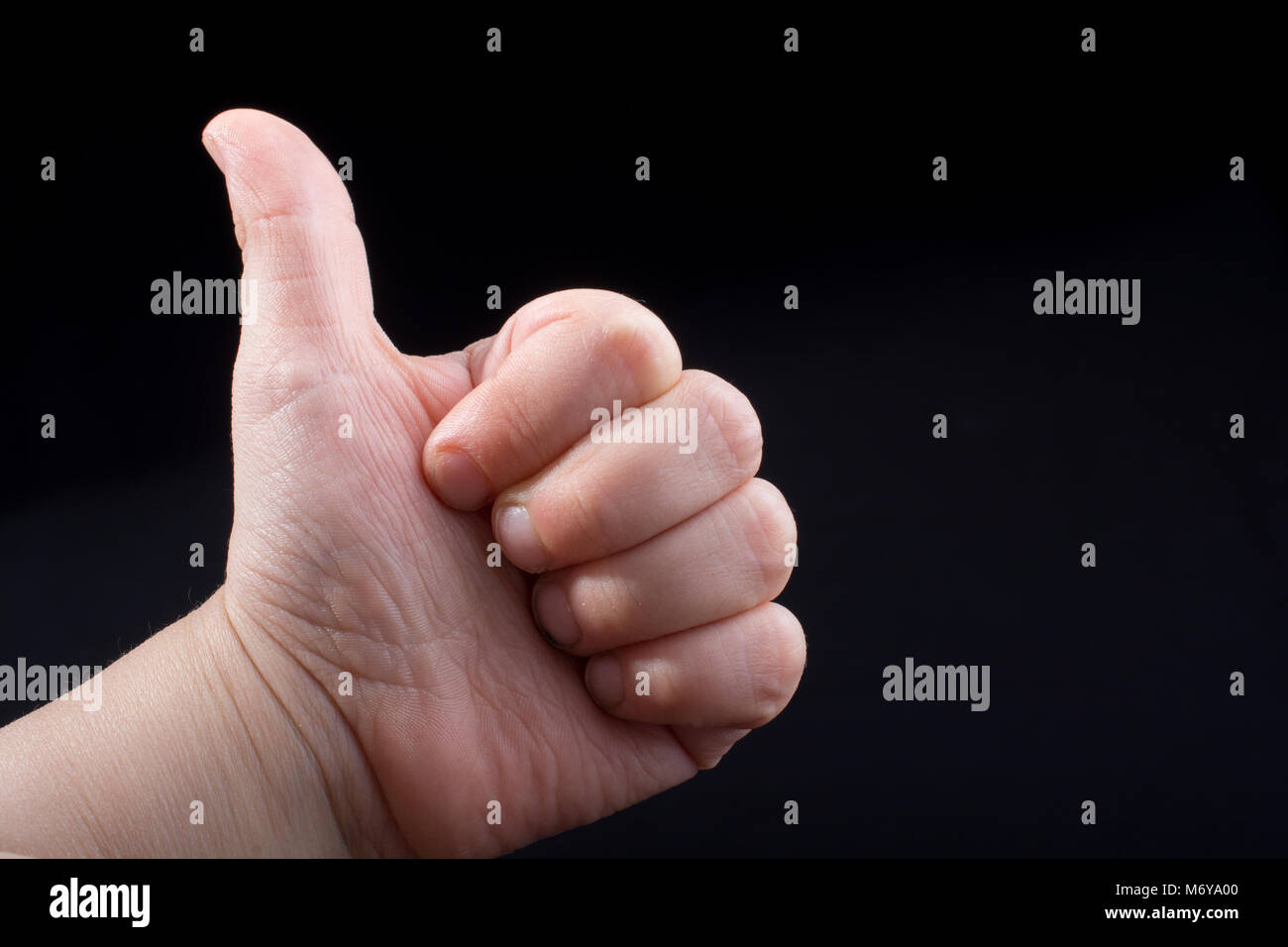 Hand closed for a fist gesture in black Stock Photo - Alamy