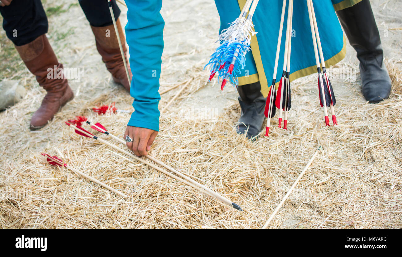 Arrow in hand as rprojectile weapon system archery Stock Photo - Alamy