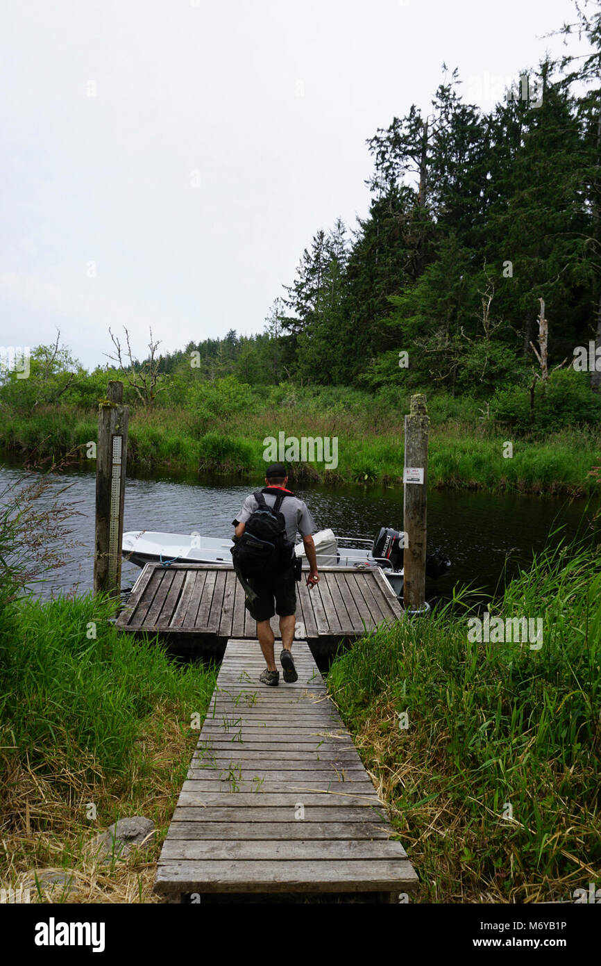 ranger employee boat dock ramp ozette lake d archuleta Stock Photo - Alamy