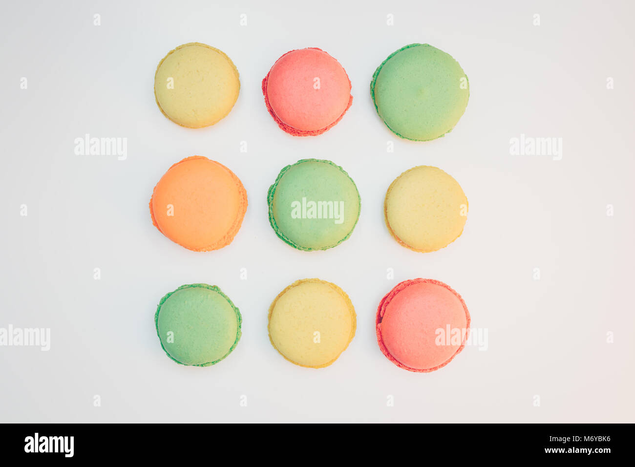 Assorted sweet pastel color macaroons on white background top view ...