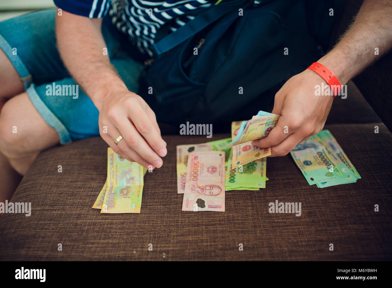 Vietnam dong money in hand the tourist cash Stock Photo - Alamy