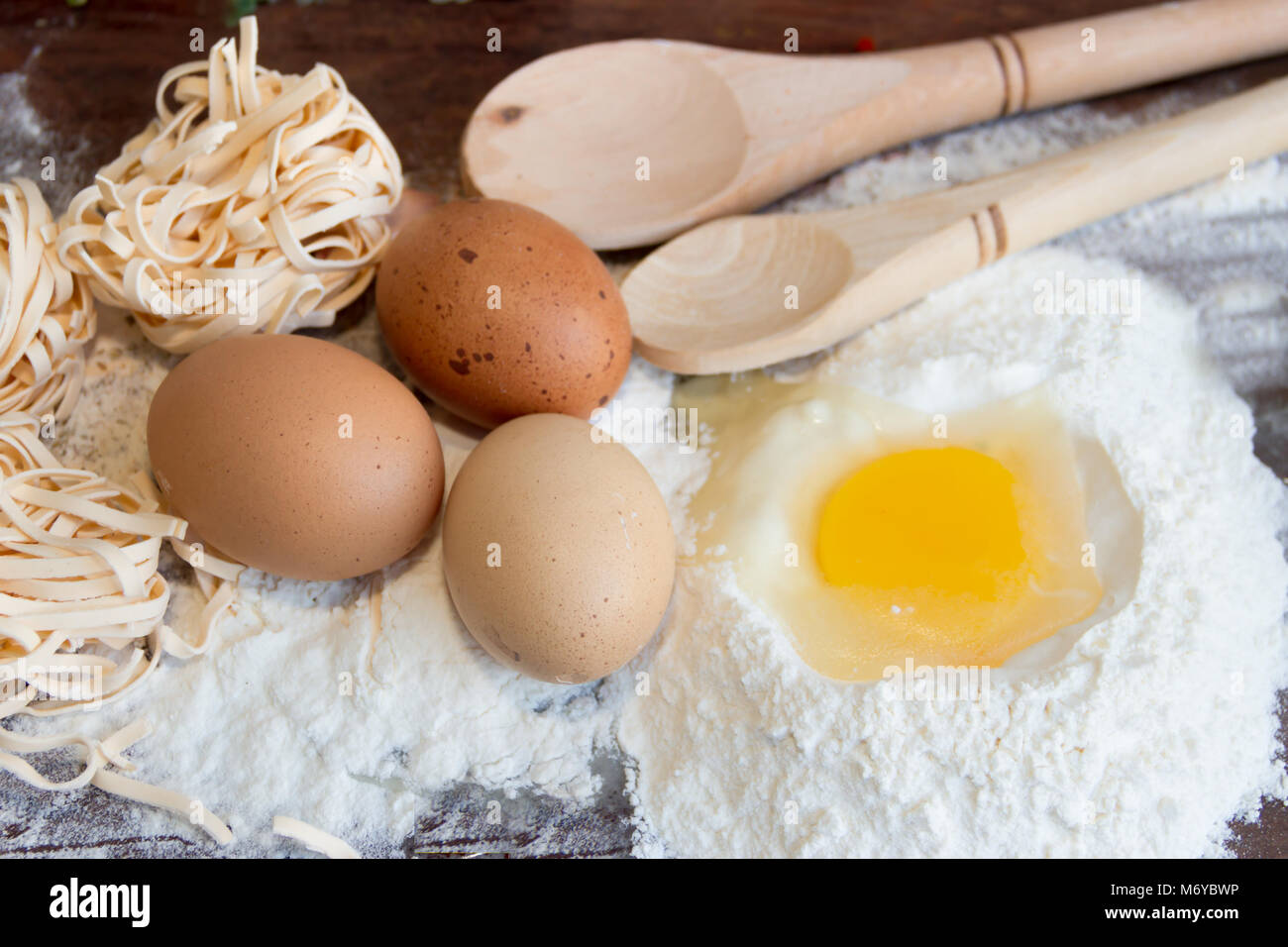 ingredients preparation spaghetti with eggs, tomatoes herbs and spices ...