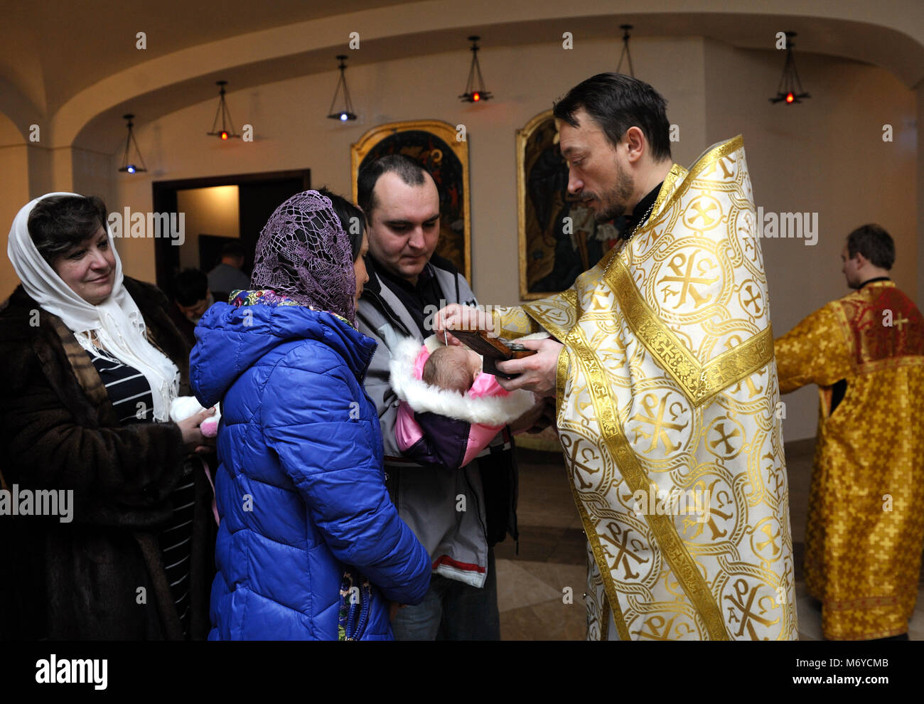 Orthodox priest baptizing hi-res stock photography and images - Alamy