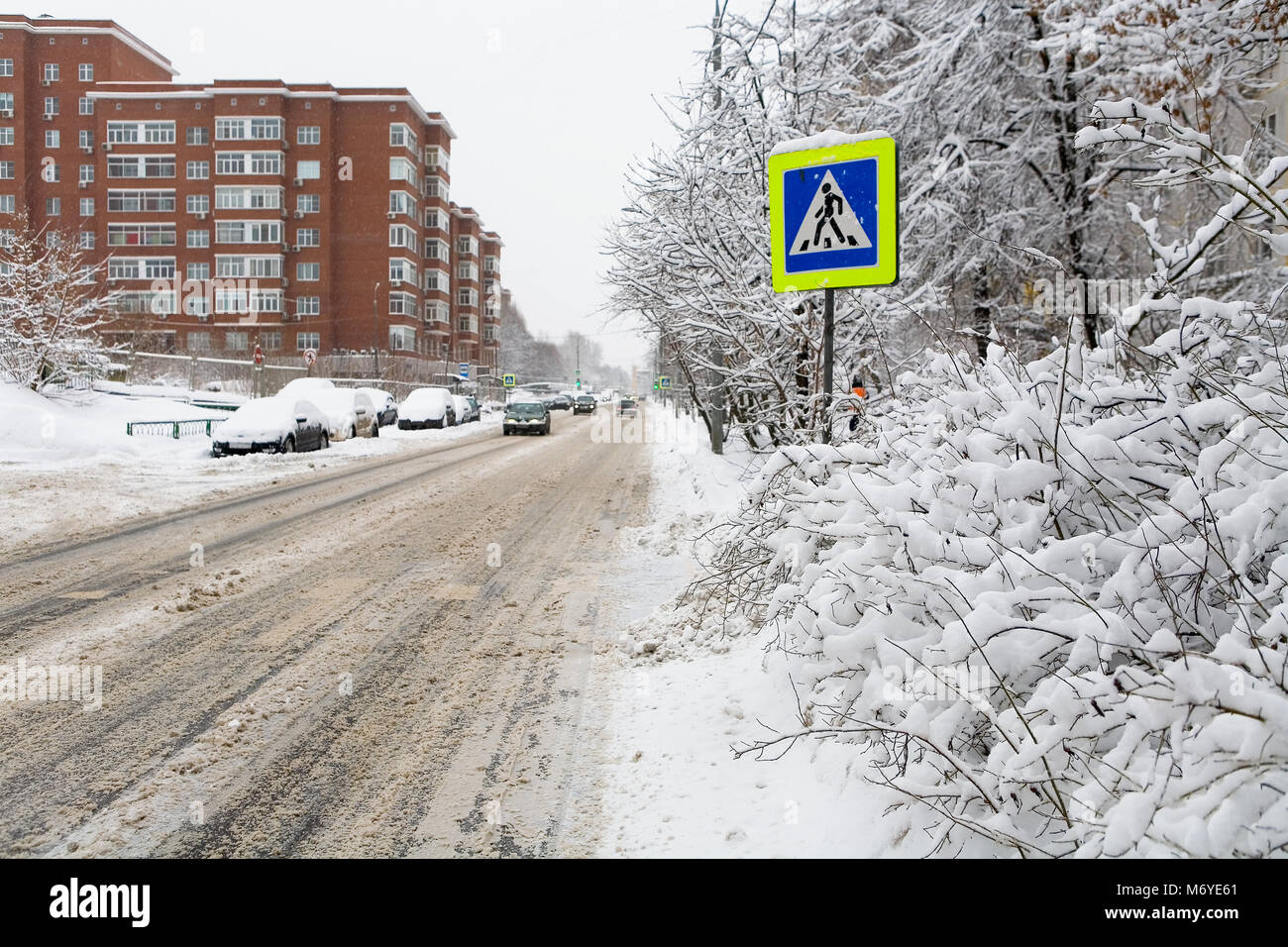 Snow covered road with pedestrian crossing hi-res stock photography and ...
