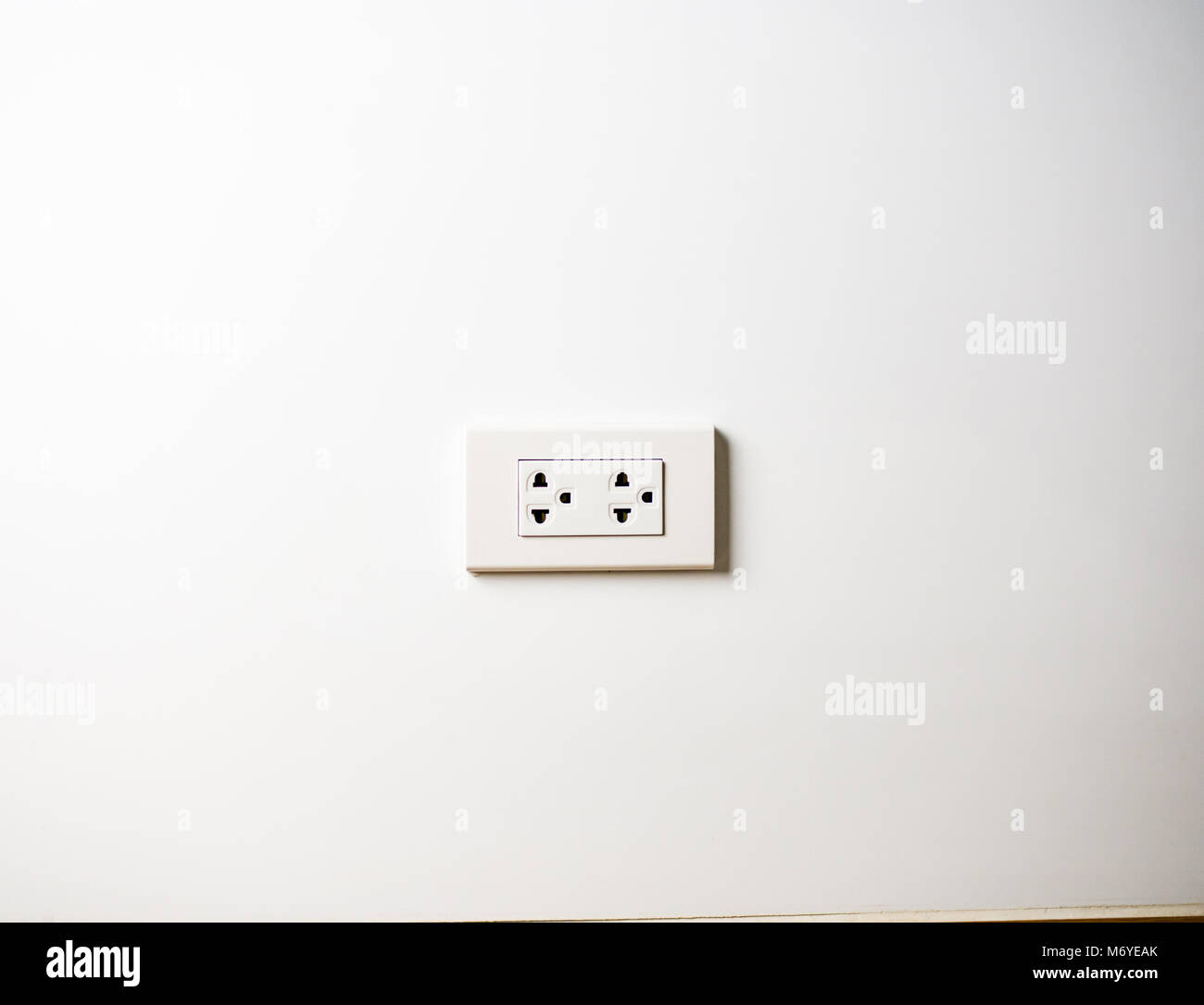 White socket 220 volts on white wall, unplugged Stock Photo - Alamy